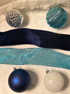 Elegant Flocked Christmas Tree With Blue And Silver Decorations