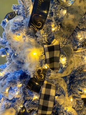 How To Add Ribbon To Decorate A Beautiful Blue Flocked Christmas Tree